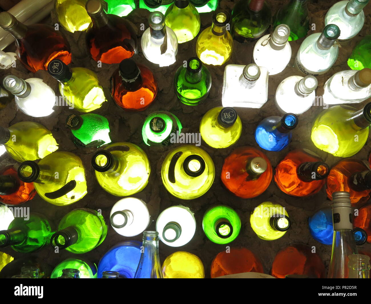 An aerial view of an array of multi-coloured empty wine and beer glass ...