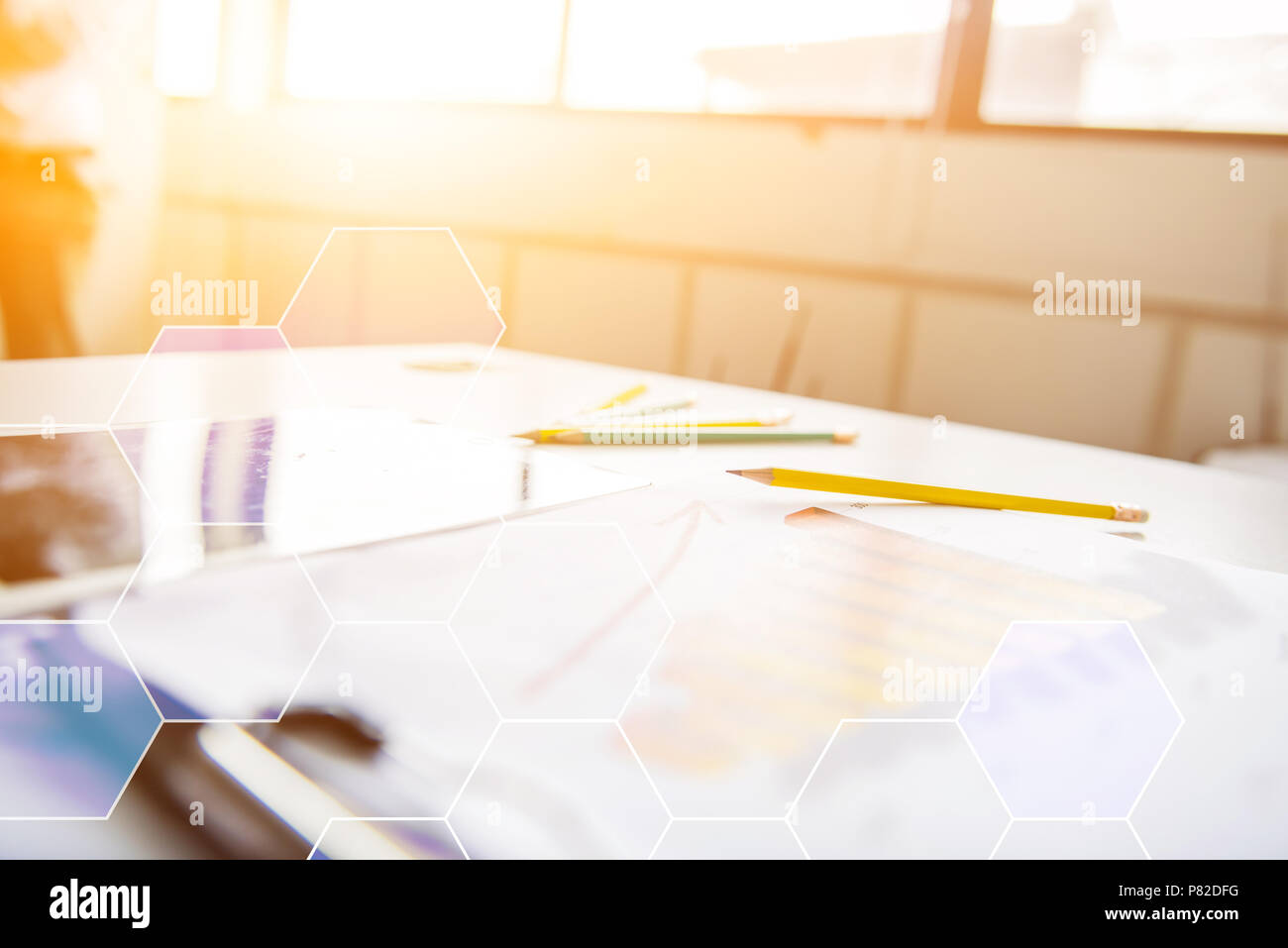 tablet on the table with paper chart Stock Photo - Alamy