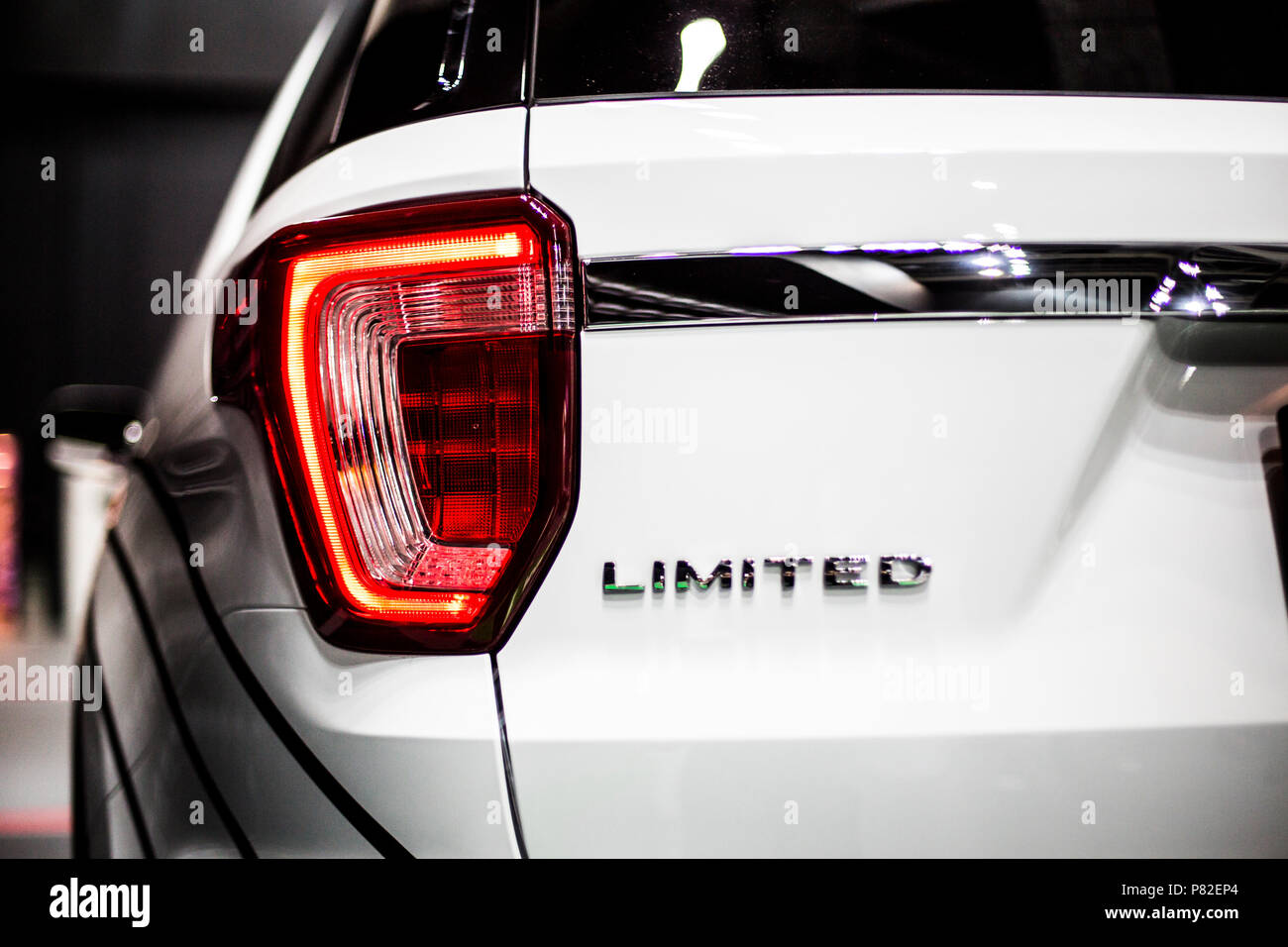 Rear stop light of large SUV car with Limited emblem Stock Photo - Alamy