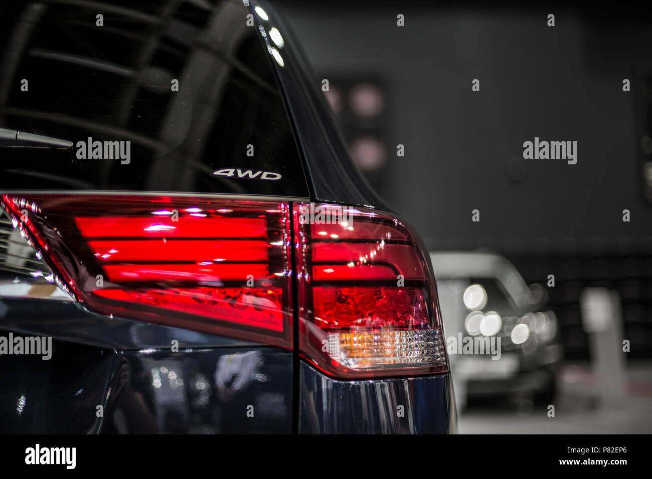 Rear stop light of SUV car with 4WD emblem Stock Photo - Alamy
