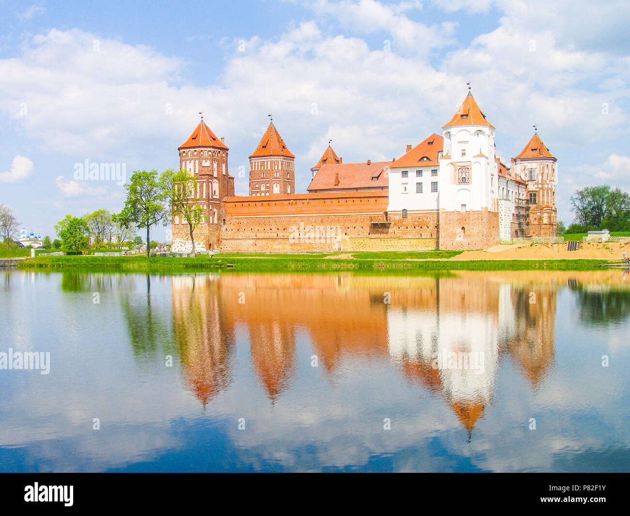 Mir, Belarus. Castle Complex Mir reflected in lake On Sunny Day with ...