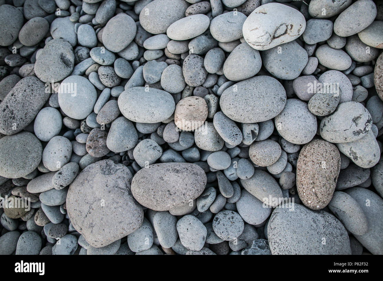 pebble stone on beach texture background Stock Photo - Alamy