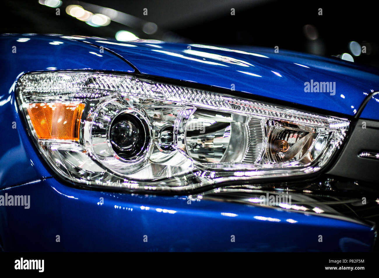 headlight of modern blue car with led and xenon optics Stock Photo - Alamy