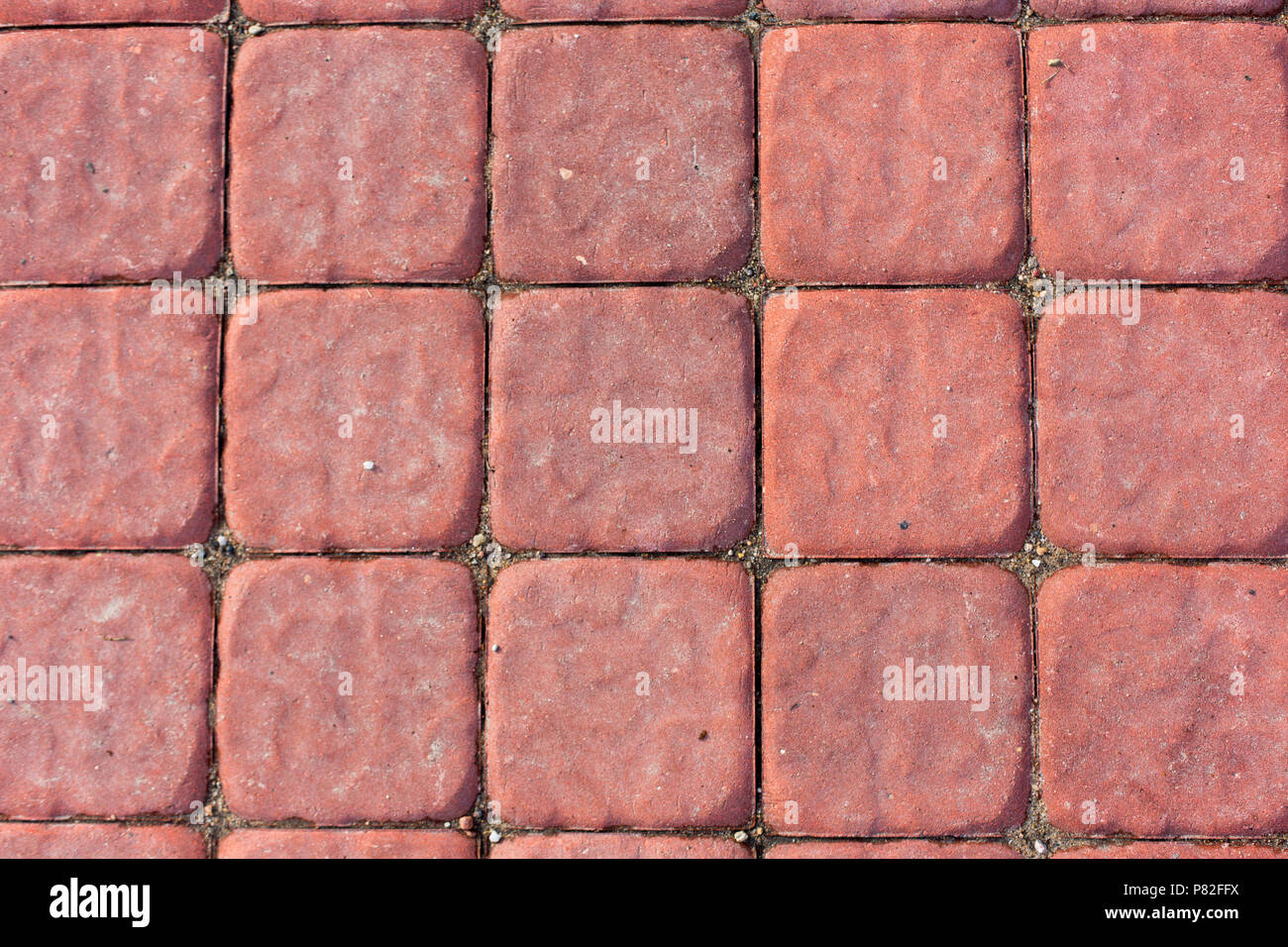 red concrete tile square pattern texture background Stock Photo - Alamy