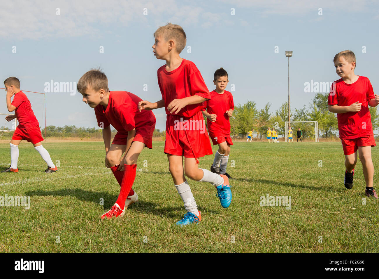 Kids soccer football - small children players exercising before match ...