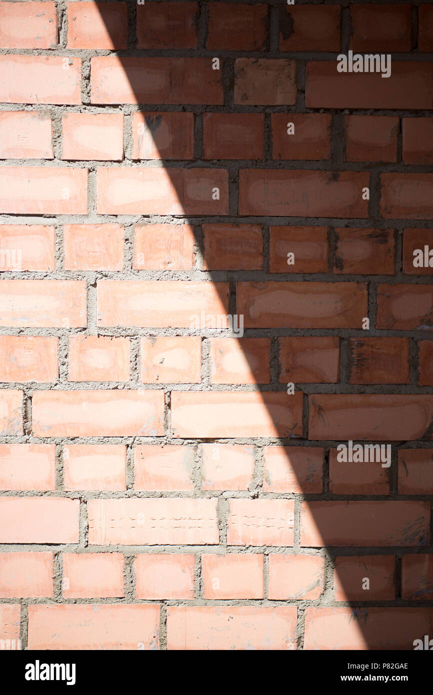 Brick wall with shadow pattern texture background Stock Photo - Alamy