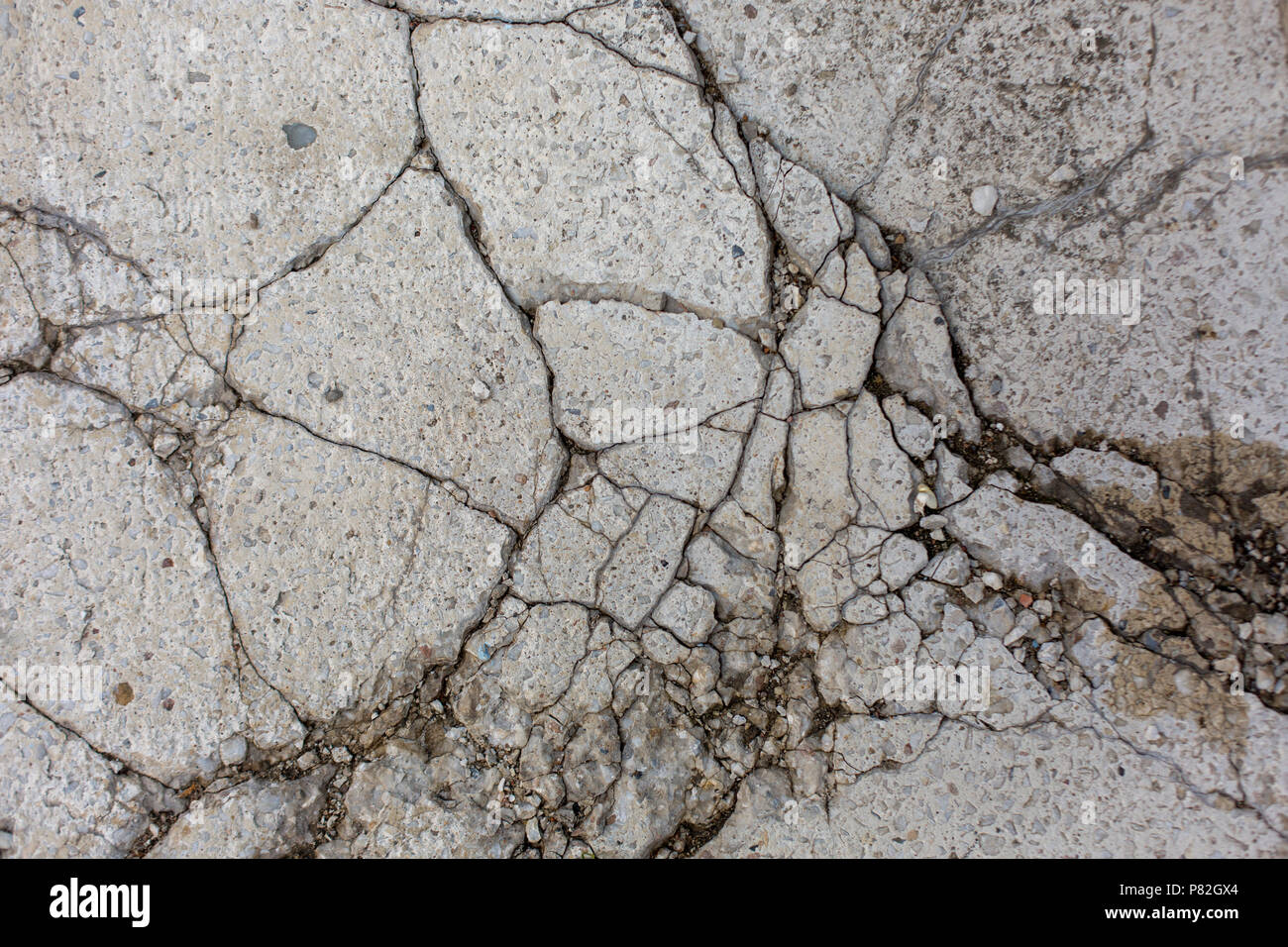 cracks in the stone floor pattern texture background Stock Photo - Alamy