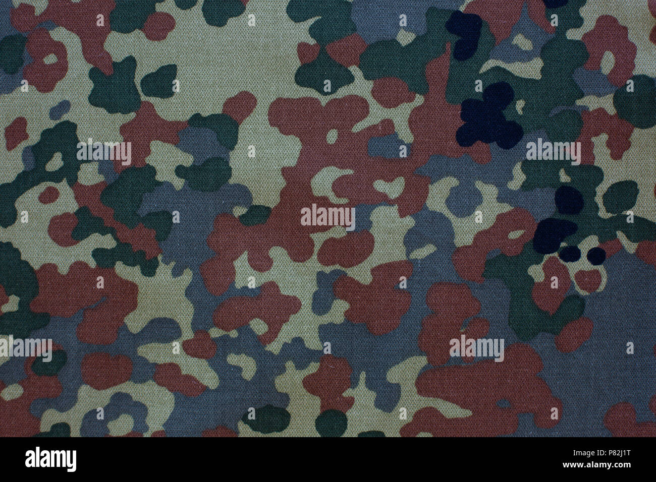 Camouflage pattern cloth texture. Abstract background and texture for ...