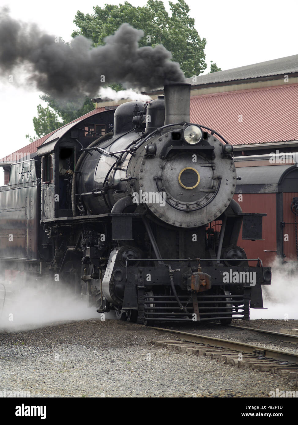 Steam train pulling into the station Stock Photo - Alamy