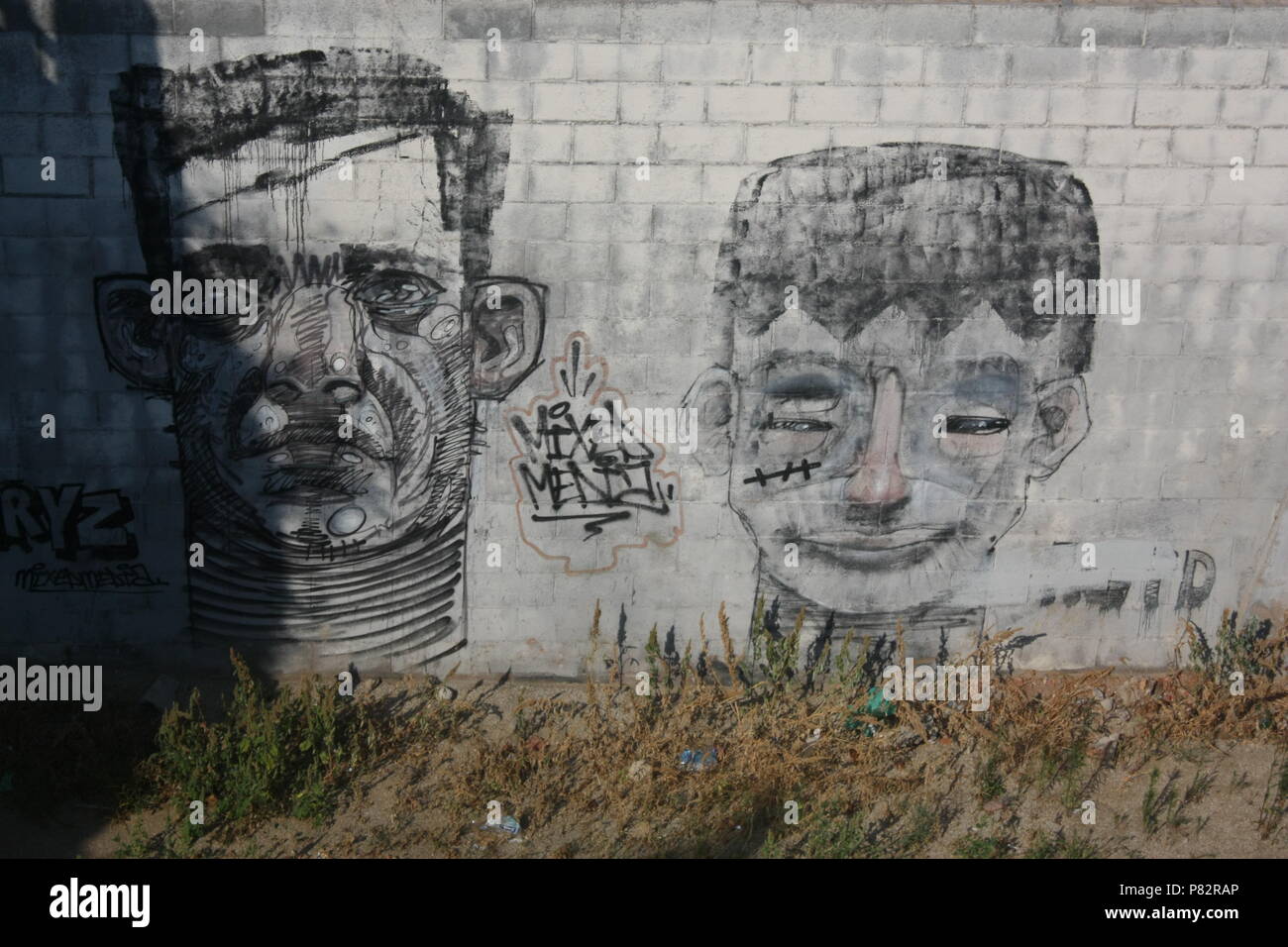 criminals Graffiti on wall Stock Photo - Alamy