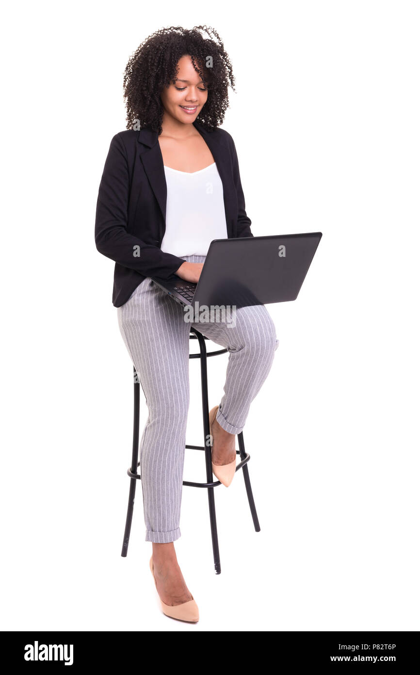 African business woman sitting desk Cut Out Stock Images & Pictures - Alamy
