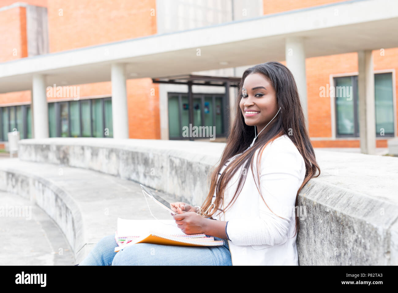 Happy african young student at the university campus Stock Photo - Alamy
