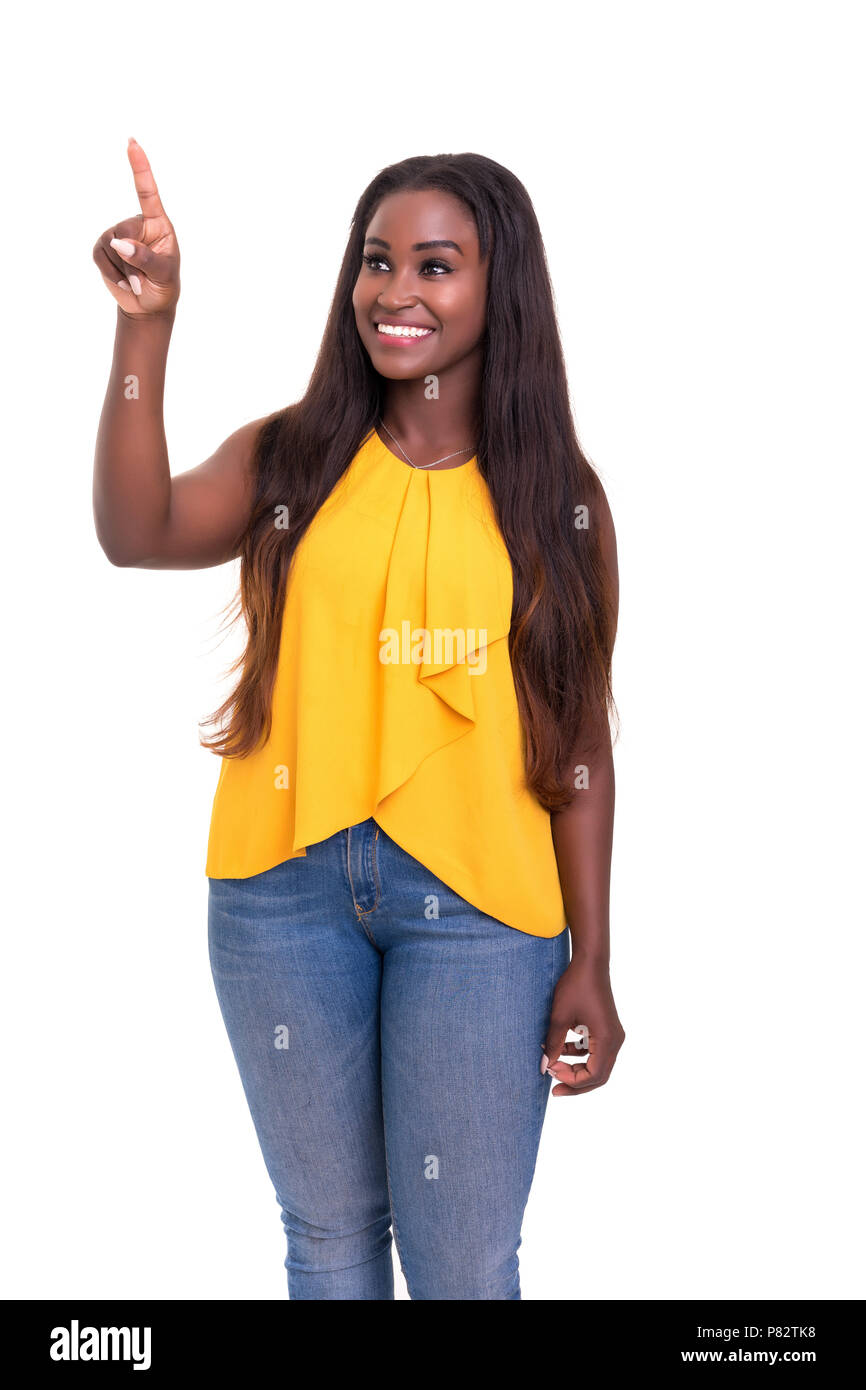 A beautiful african woman pointing to something, isolated over a white ...