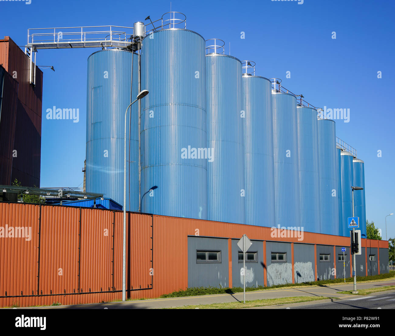 Chemical factory with the big blue tanks Stock Photo - Alamy