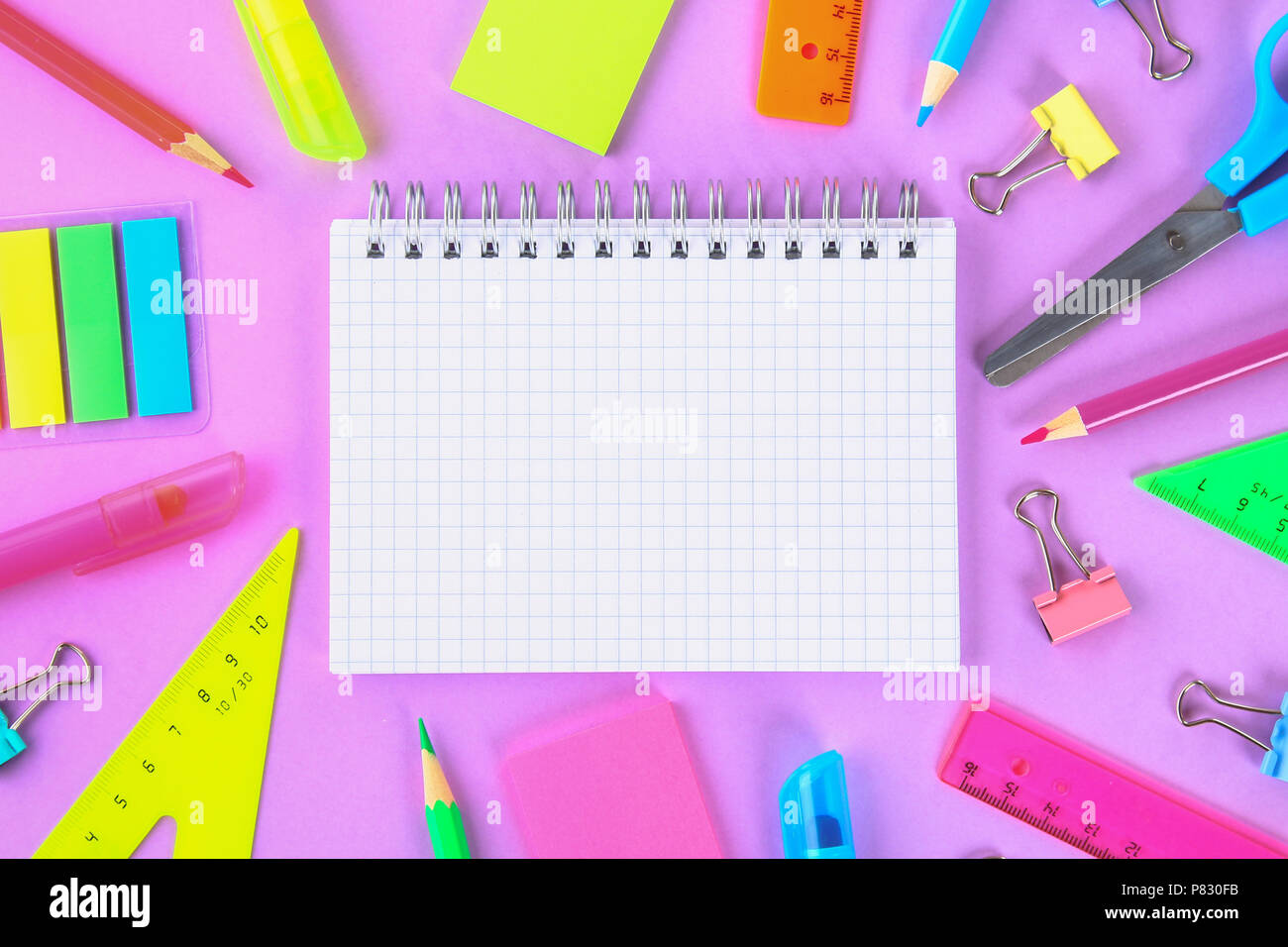 School supplies on violet background ready for your design. Flat lay ...