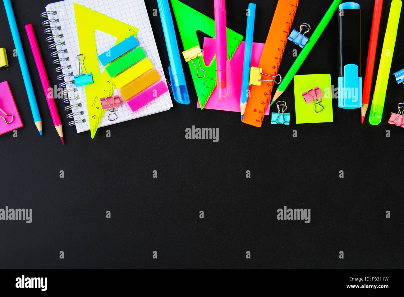 School supplies on blackboard background ready for your design. Flat ...