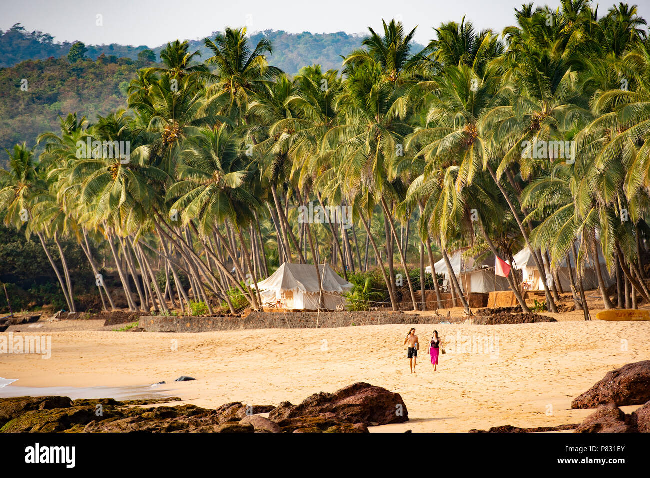 VARKALA - INDIA - 16 FEBRUARY 2018. A couple is walking on a beautiful ...