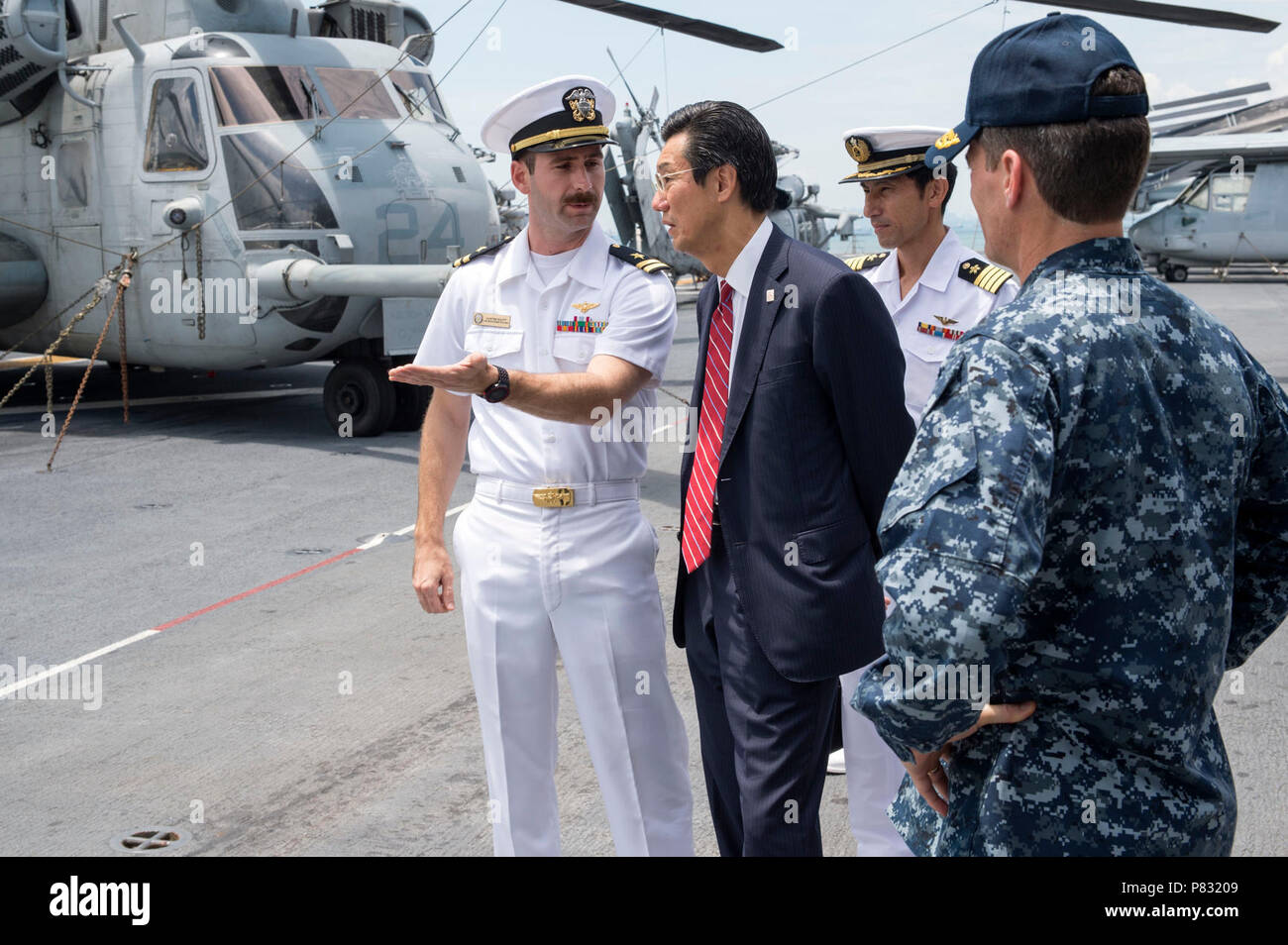 SINGAPORE (Oct. 18, 2016) Lt. Hunter Scott discusses flight deck ...