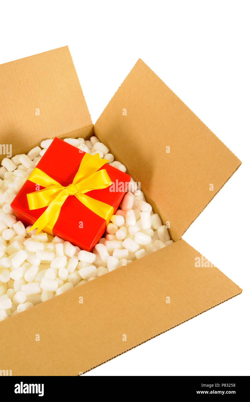 Cardboard shipping delivery box with red gift inside and polystyrene ...
