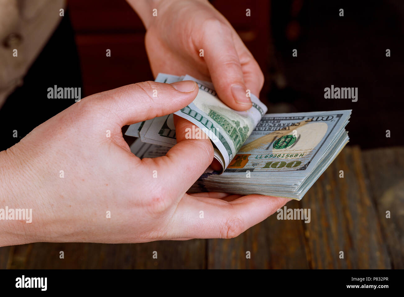 Woman counting dollar bills in hi-res stock photography and images - Alamy