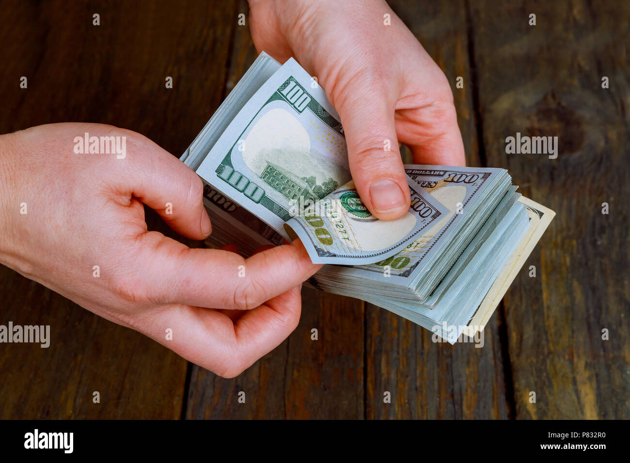 Hands counting us dollar bills hi-res stock photography and images - Alamy