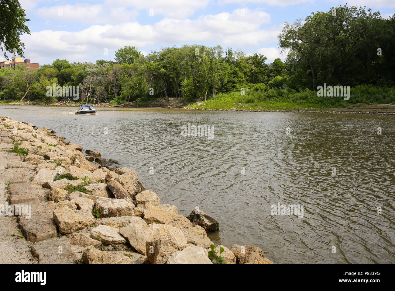 Solitaire boat in a peacefull landscape. Assiniboine River, Winnipeg ...