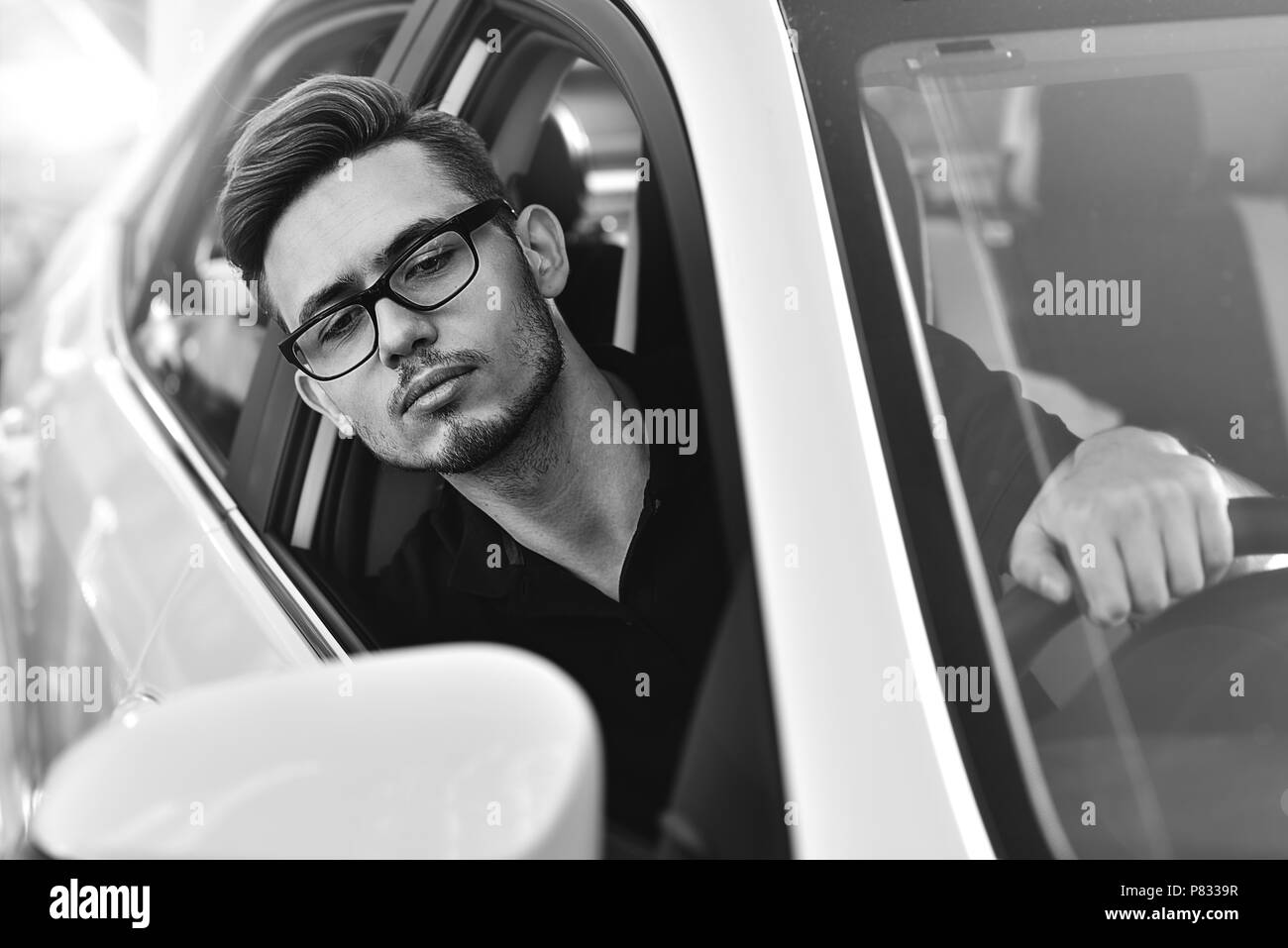 Man driving new car Black and White Stock Photos & Images - Alamy
