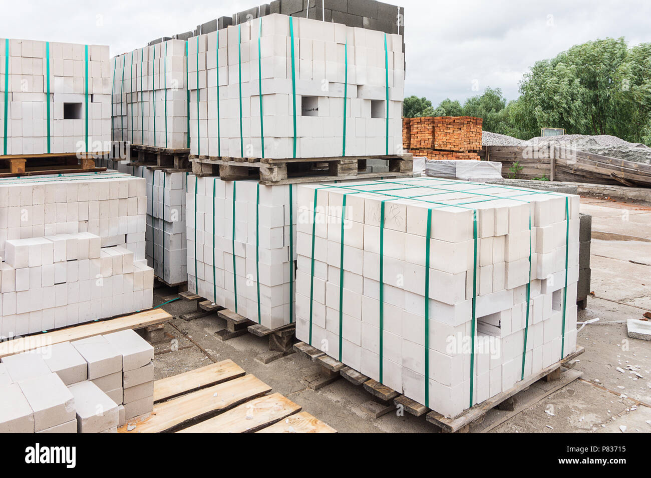 White bricks stacked on pallets Stock Photo - Alamy