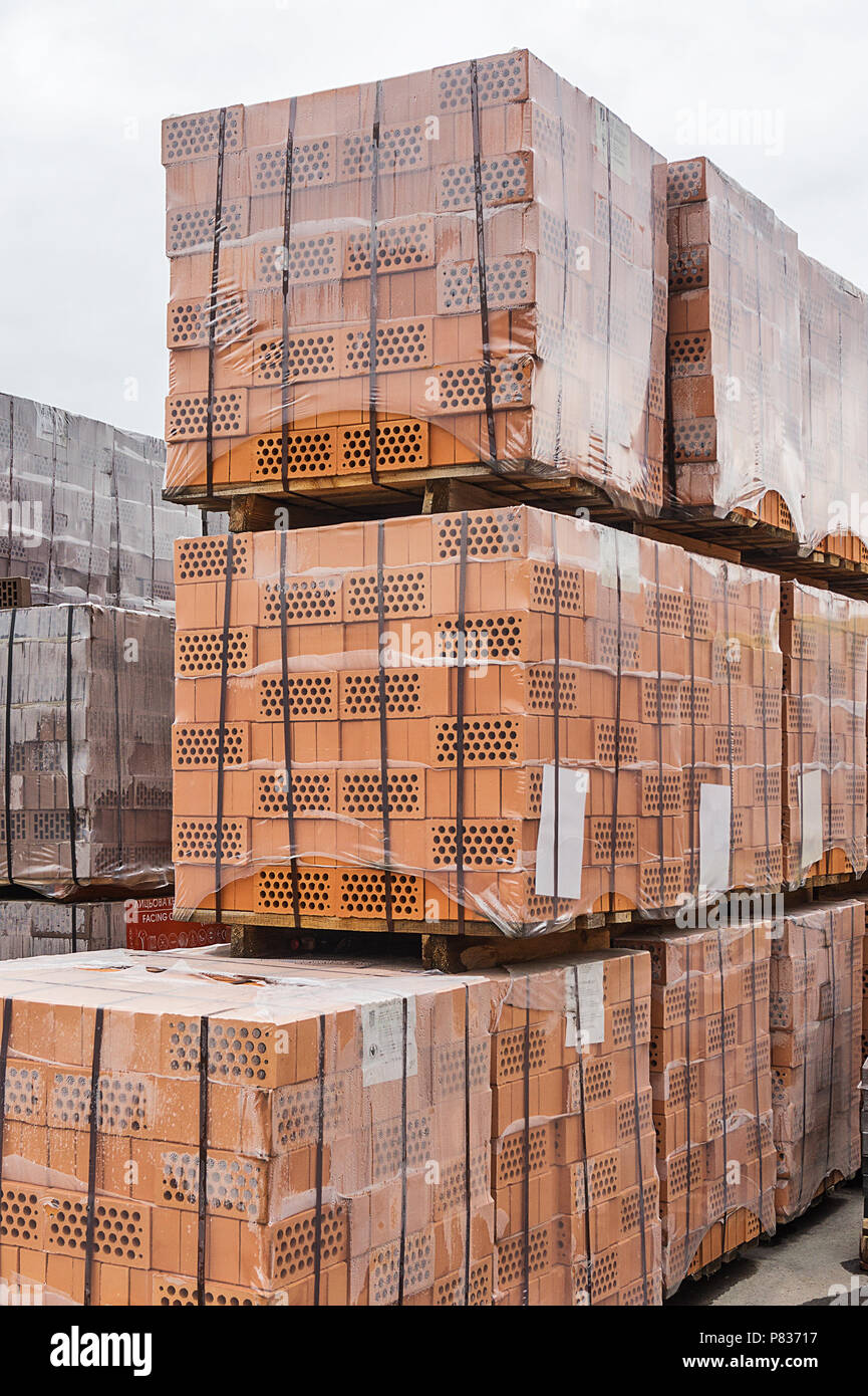 Folded and packed red bricks Stock Photo - Alamy