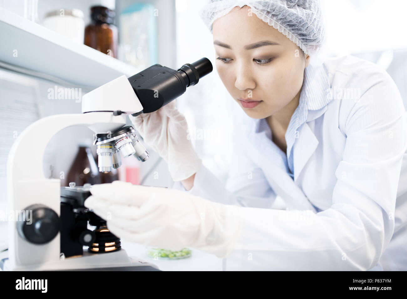 Female Scientist Using Microscope Stock Photo - Alamy