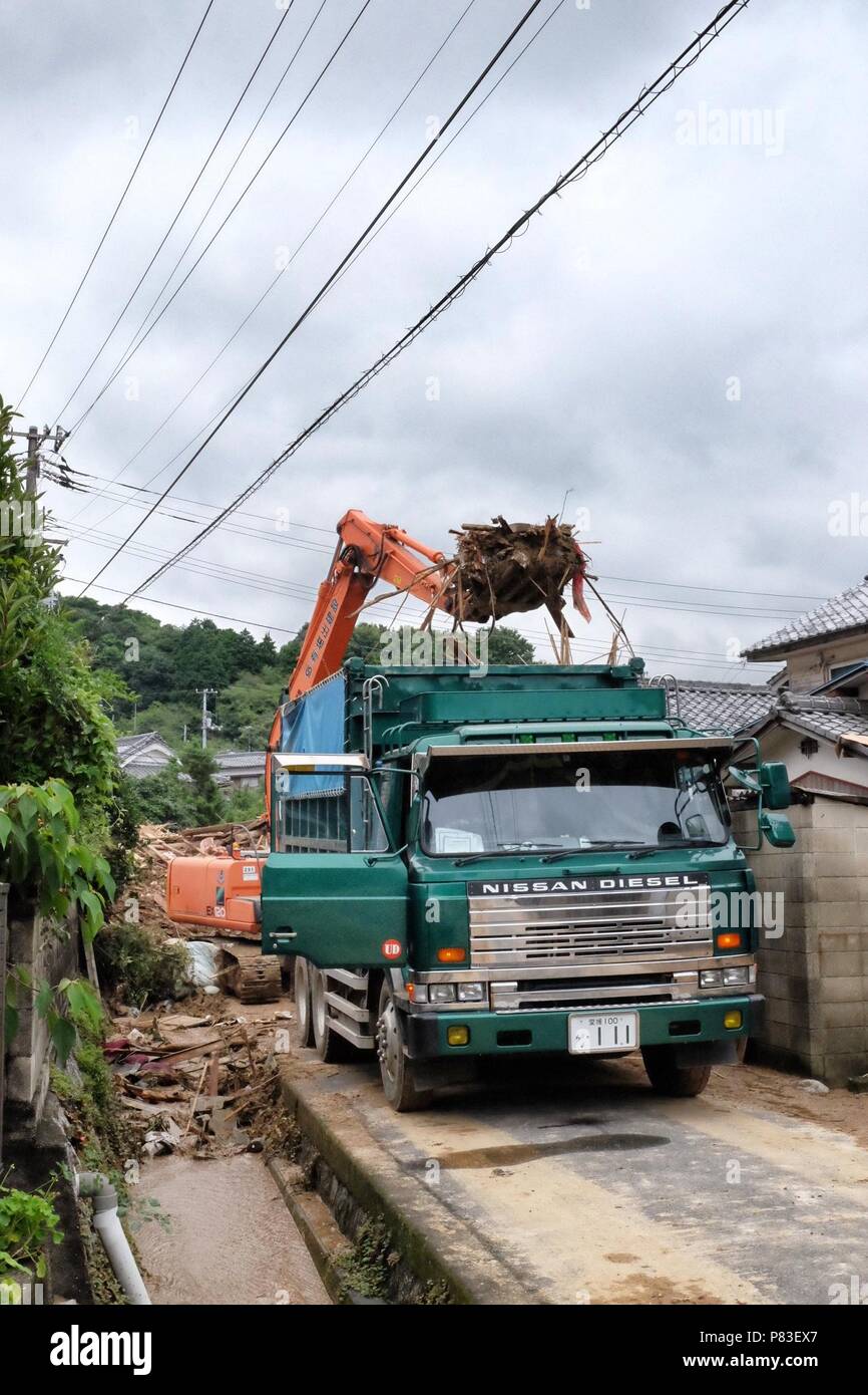 June 8, 2018. Earth movers work to clean up landslides in Hojo, Ehime ...
