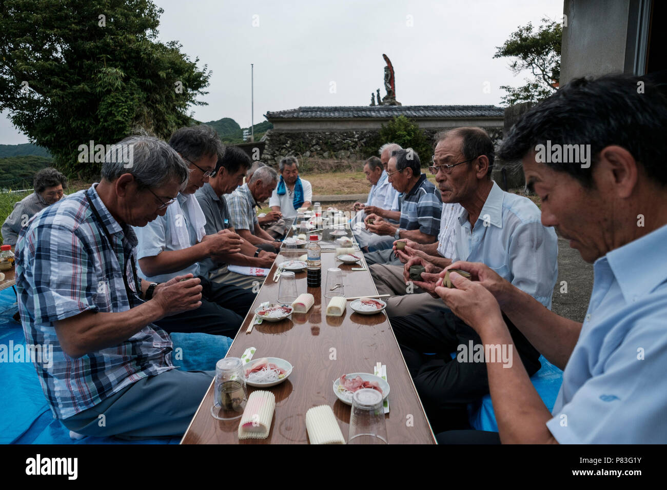 Men for Hidden Christian community members do communion after a ...