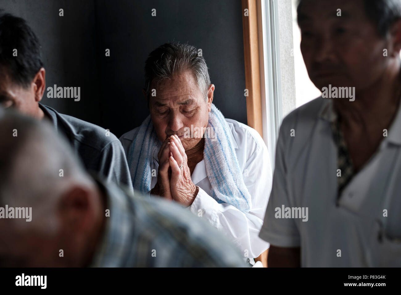 Hidden Christian community members prays and sing orasho during a ...