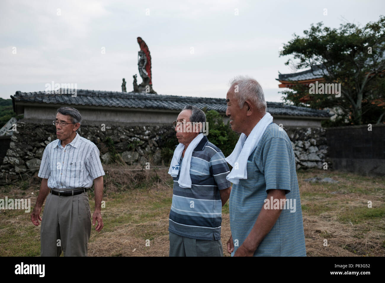 Mr. Tanaka (center) talks with Hidden Christian community members after ...