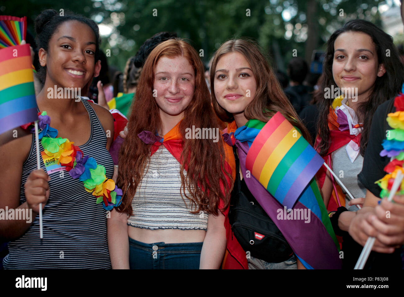 Girls with multicolored flags seen during the 2018 Pride Parade ...