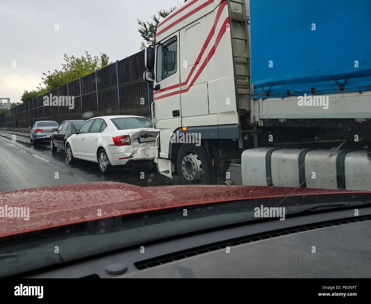 Car incident on highway from passing car. Truck hit passenger car in ...