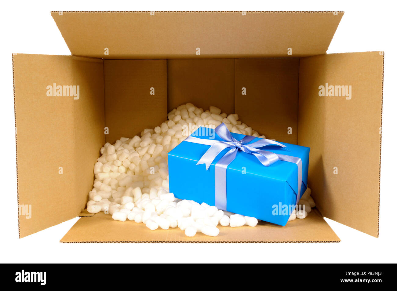 Cardboard shipping delivery box with blue gift inside and polystyrene ...