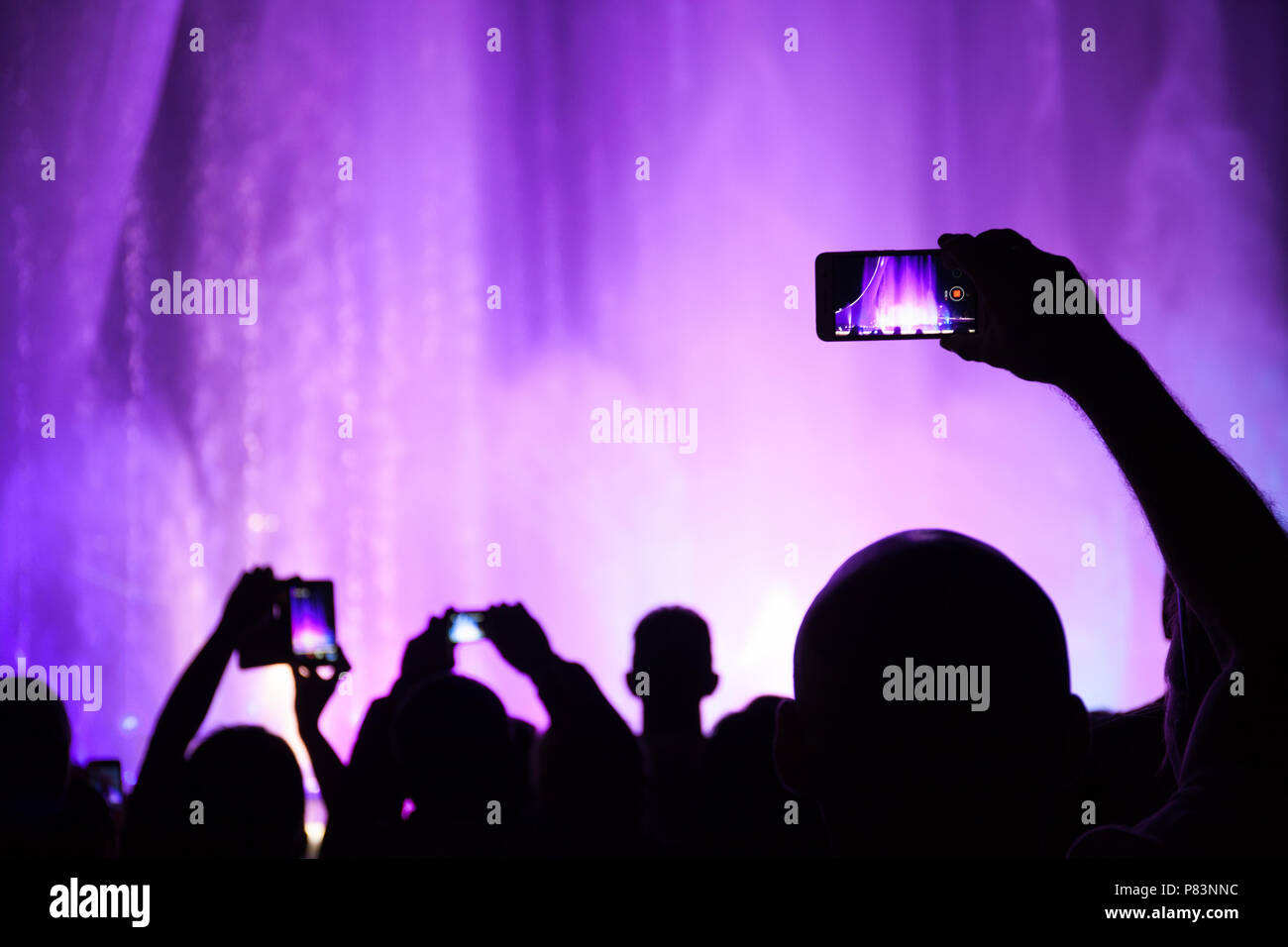 Person taking video photos concert hi-res stock photography and images ...