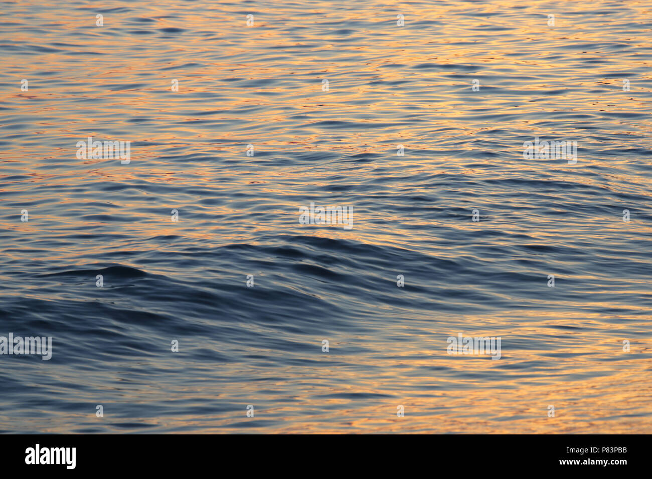Sea water ripples illuminated by sunlight Stock Photo - Alamy