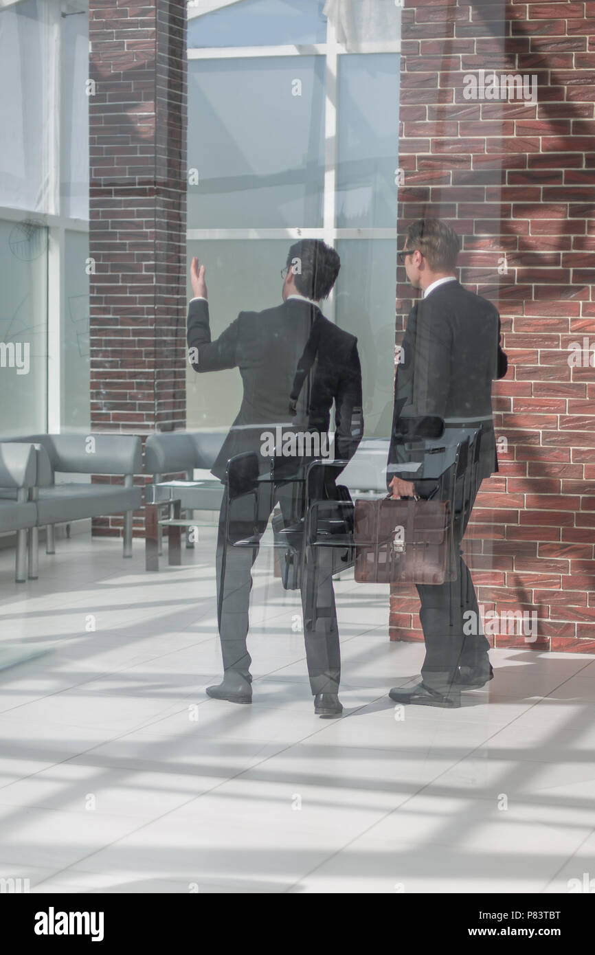 Successful executive going office hall hi-res stock photography and ...