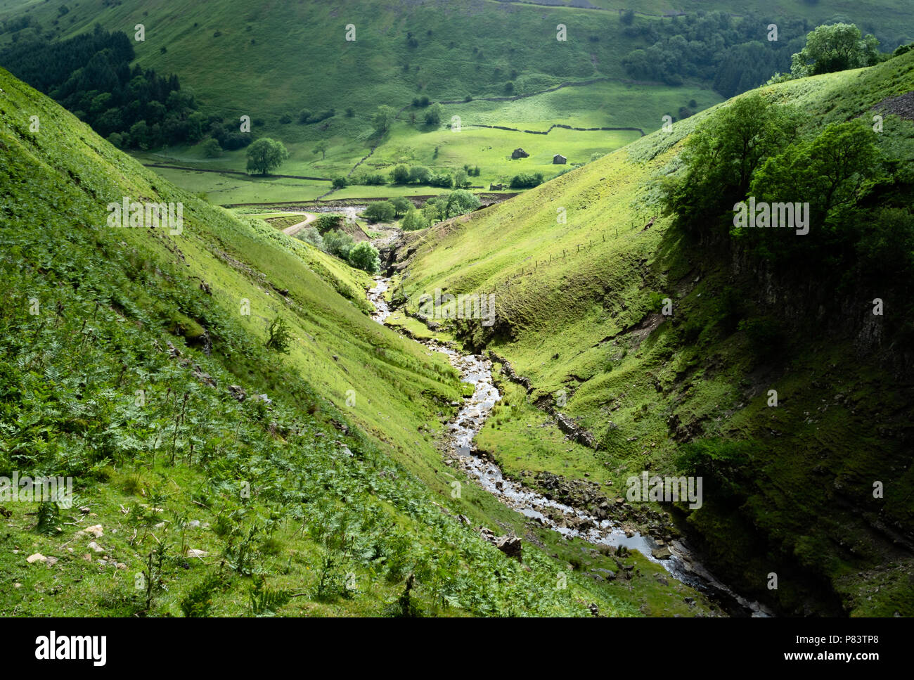 Shaft of sunlight on the deep valley of Swinner Gill as it joins the ...