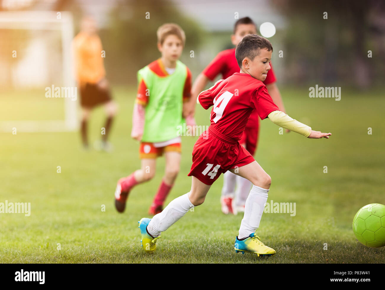 Kids soccer football - young children players match on soccer field ...