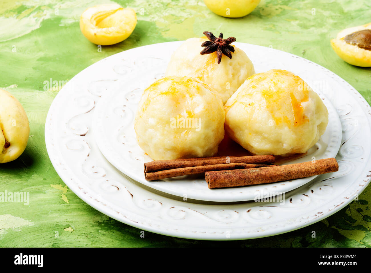 Fruit dumplings with apricot and spicy syrup Stock Photo - Alamy