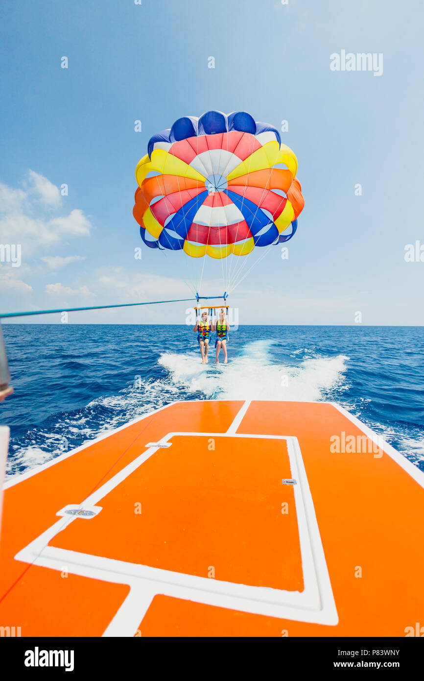 Parasailing water amusement - flying on a parachute behind a boat on a ...
