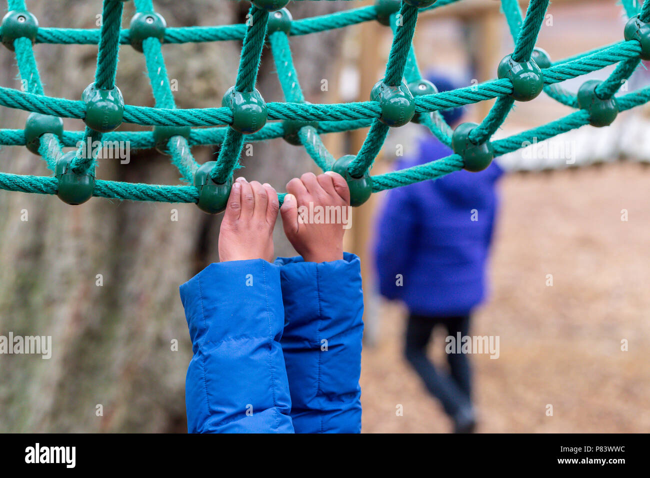 Child climbing playground equipment hi-res stock photography and images ...