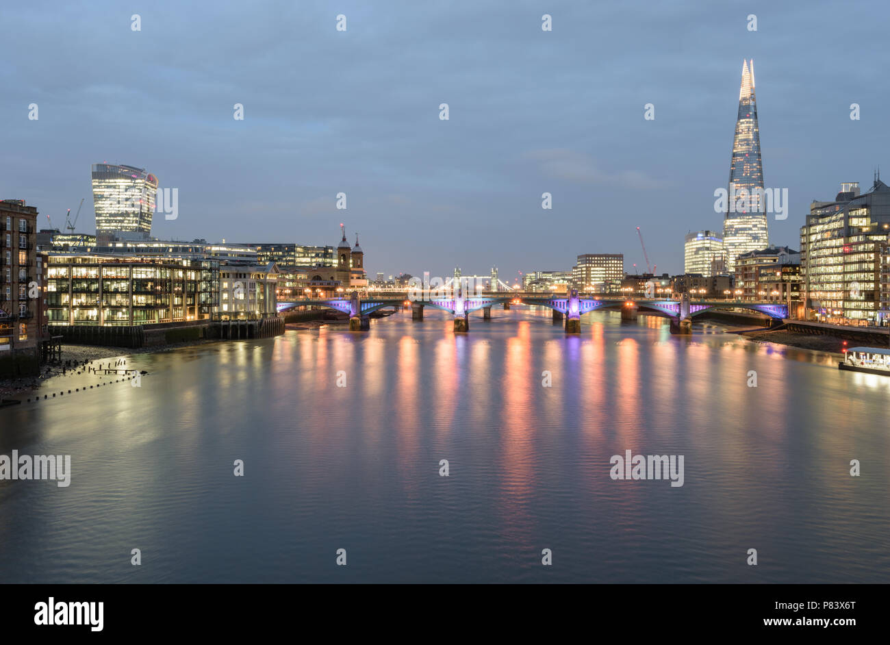 Night time view from Millennium Footbridge to London Bridge and Tower ...