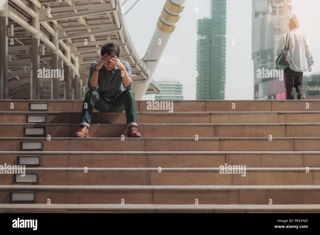 Man with failure sitting on stairway at sunlight Stock Photo - Alamy