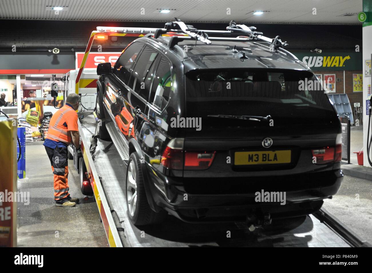 Vehicle breakdown, recovery on flatbed truck Stock Photo - Alamy