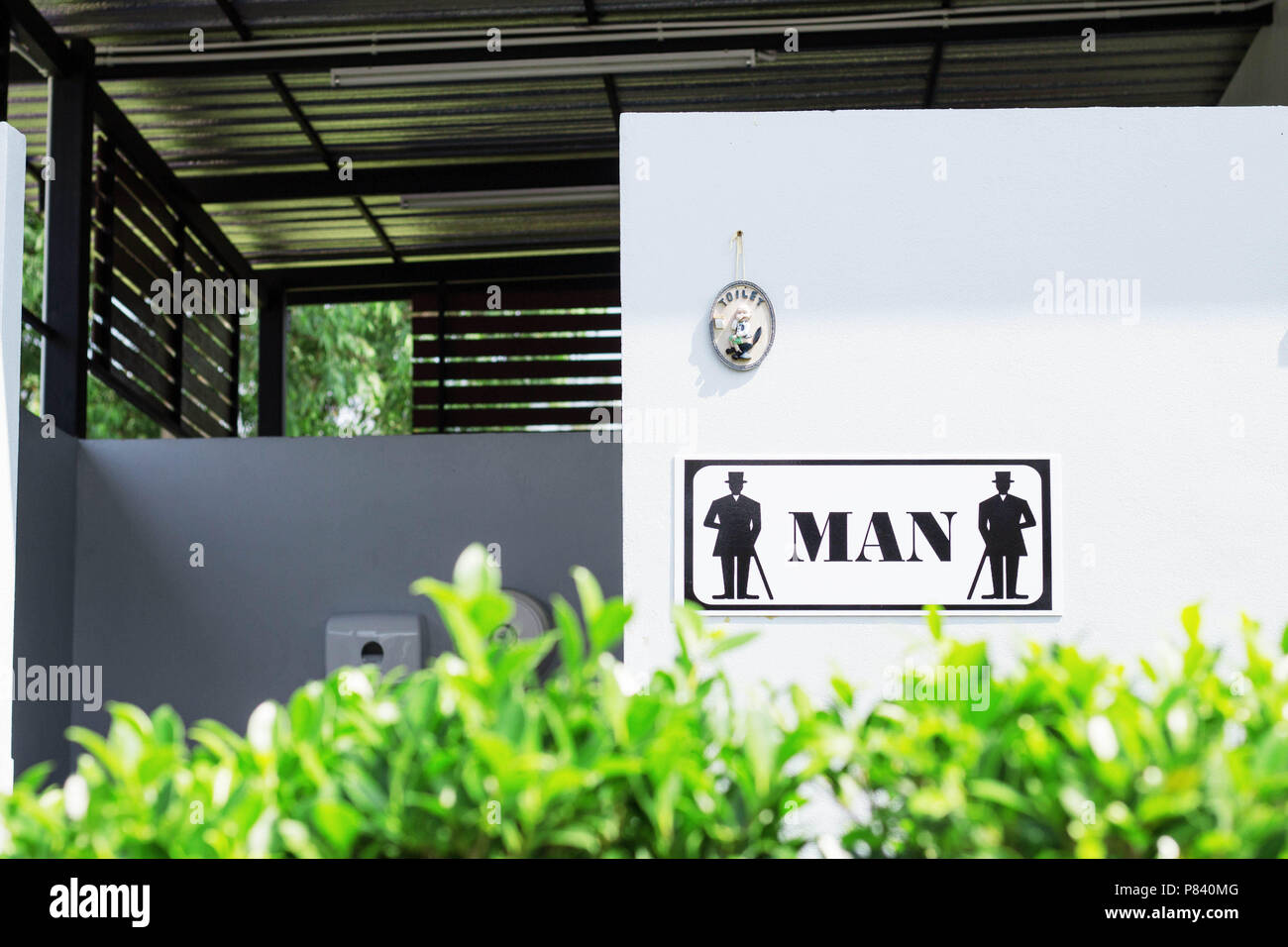 Public bathroom sign for men and women in park Stock Photo - Alamy