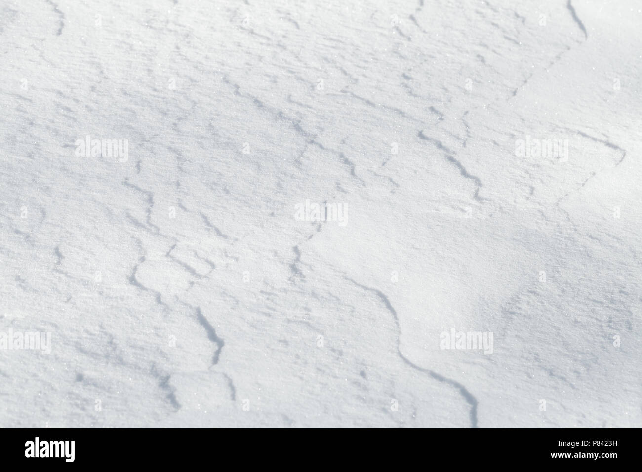 Abstract snowy background, snowdrift texture with nice curved shadows ...
